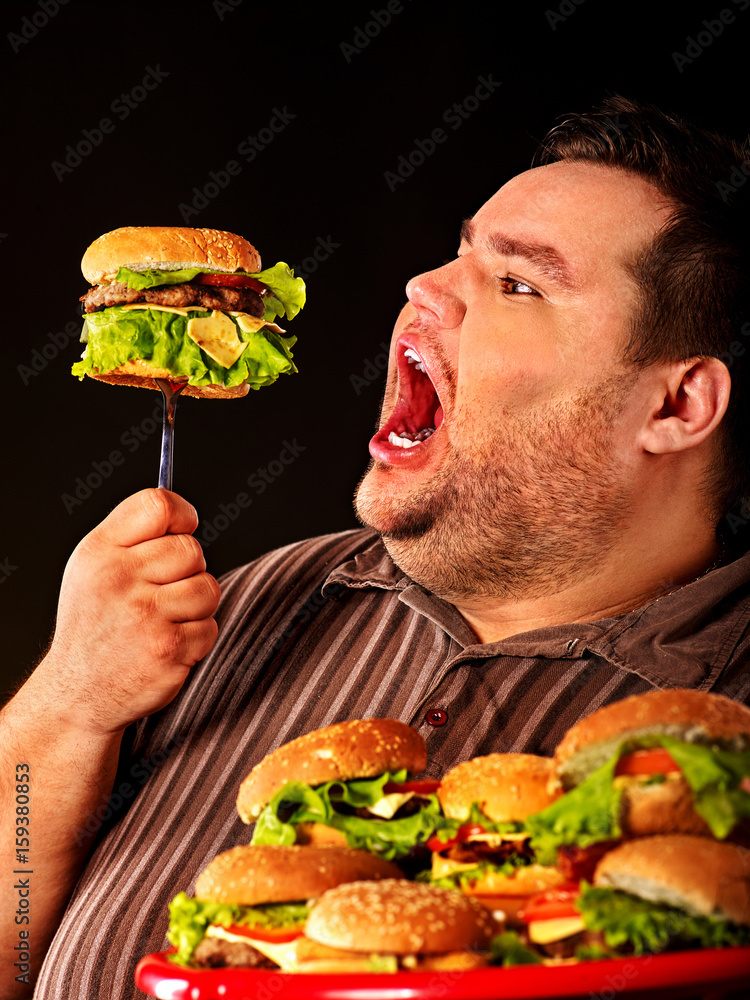 Fotografia do Stock: Diet failure of fat man eating fast food . Happy ...