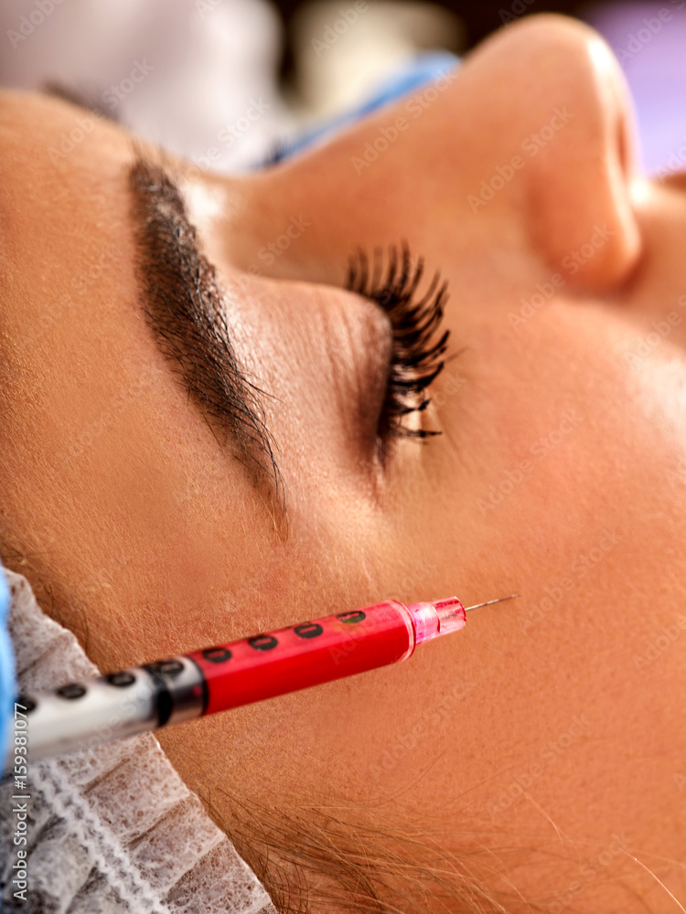 Stockfoto Filler injection for female forehead face. Plastic aesthetic ...