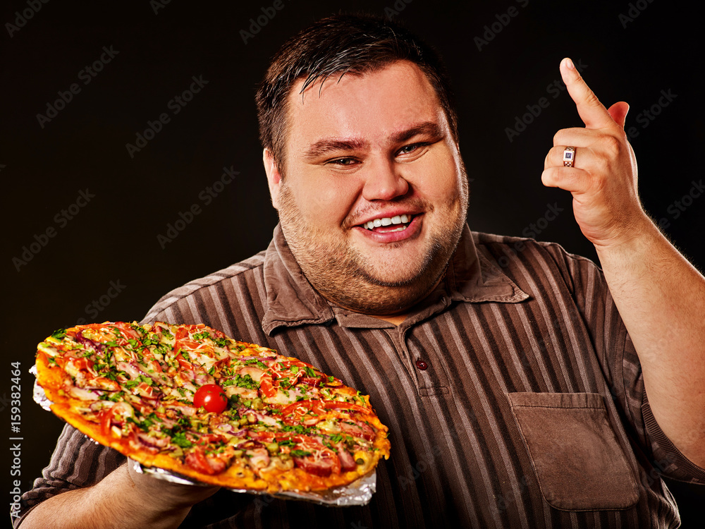 Fat Man Eating Fast Food And Offers Big Pizza To Customers Male fat-man-eating-fast-food-and-offers-big-pizza-to-customers-male