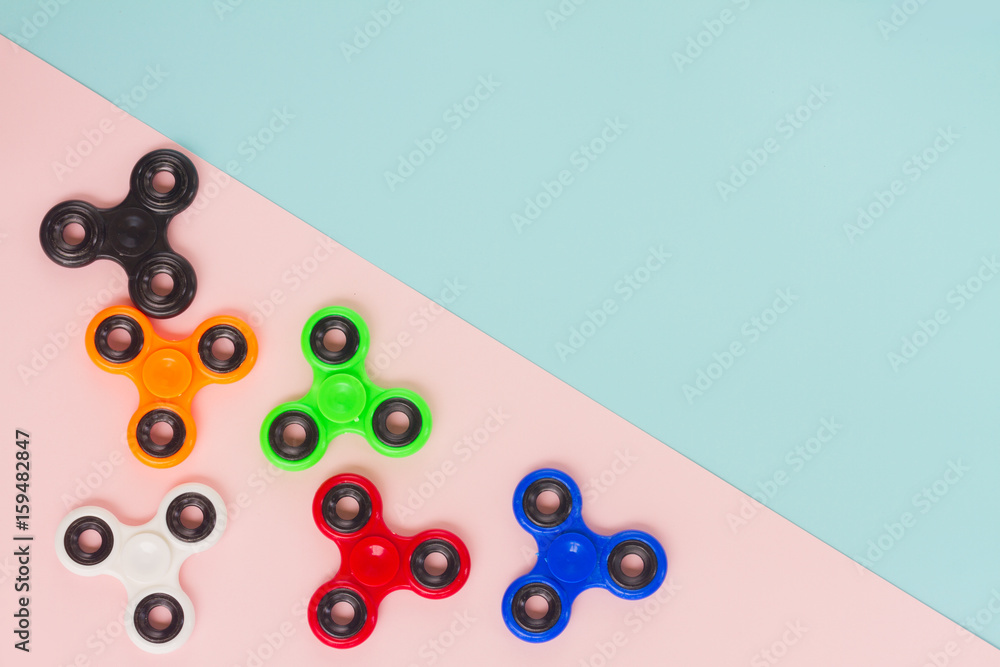 trendy fidget spinners - styled pop art flat lay scene with generic ...