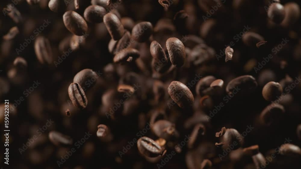 Coffee beans fly after being exploded. Shot with high speed camera ...