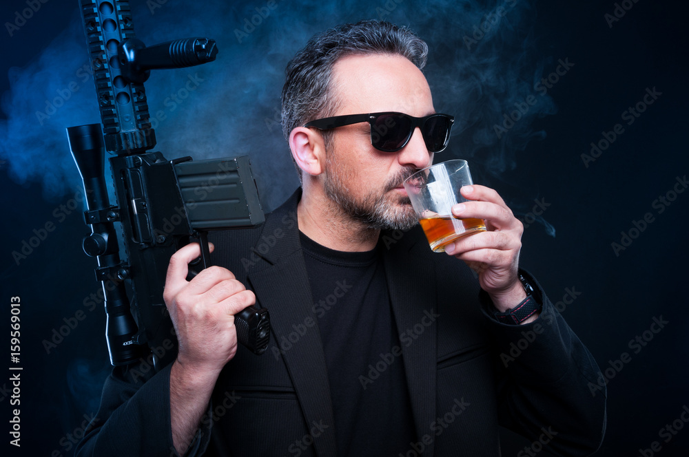 Mafia boss with his weapon or machine gun Stock Photo | Adobe Stock