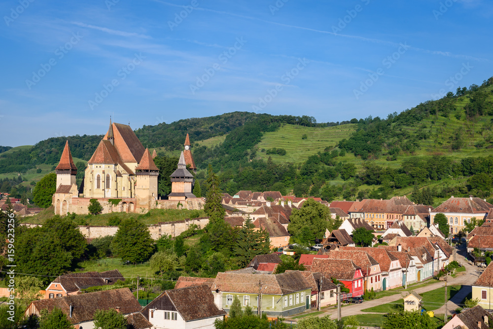 The famous Saxon village Biertan at sunrise with the UNESCO fortified ...