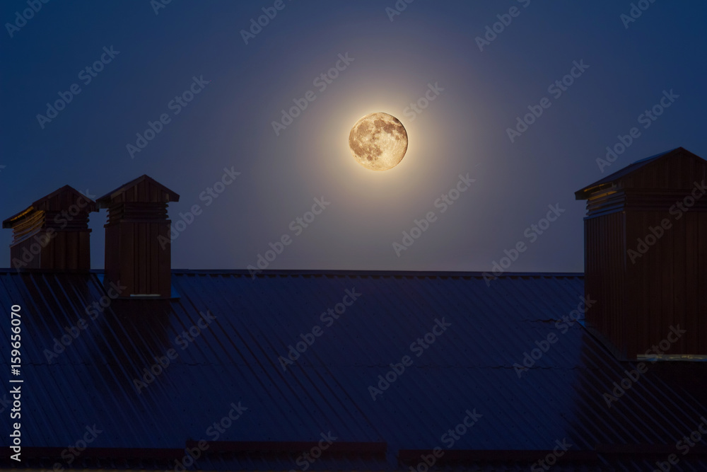 Full moon over the roof of house at night Stock Photo | Adobe Stock