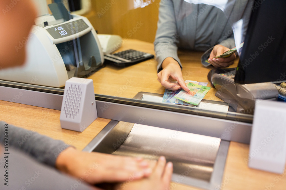 clerk counting cash money at bank office Stock Photo | Adobe Stock