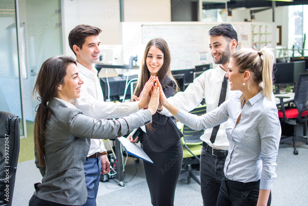 Business people gathering hands in unity celebrating team spirit. Stock ...