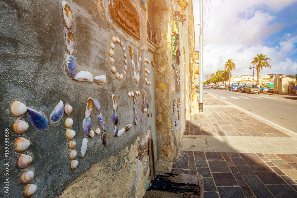 Marsaxlokk, Malta - Traditional maltese fishing village and house with ...