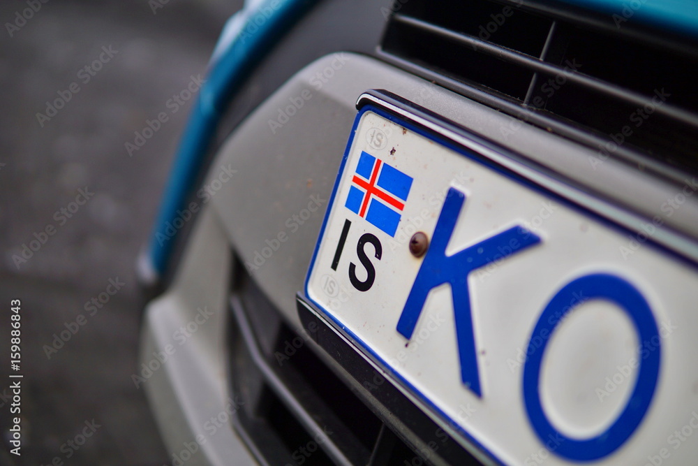 Detail of an Icelandic flag in the corner of license plate placed at ...