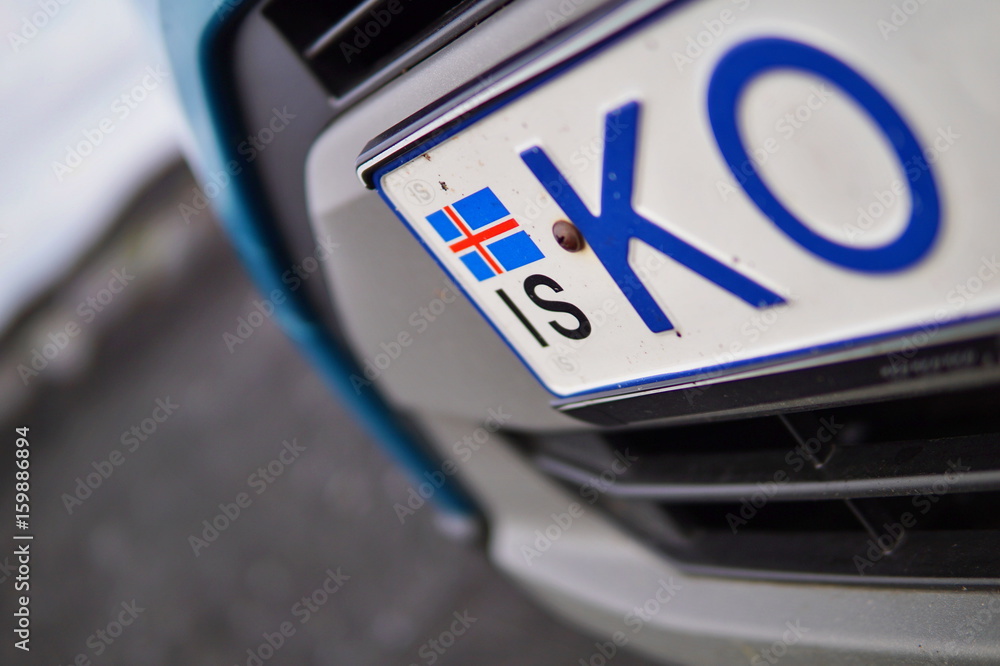 Detail of an Icelandic flag in the corner of license plate placed at ...