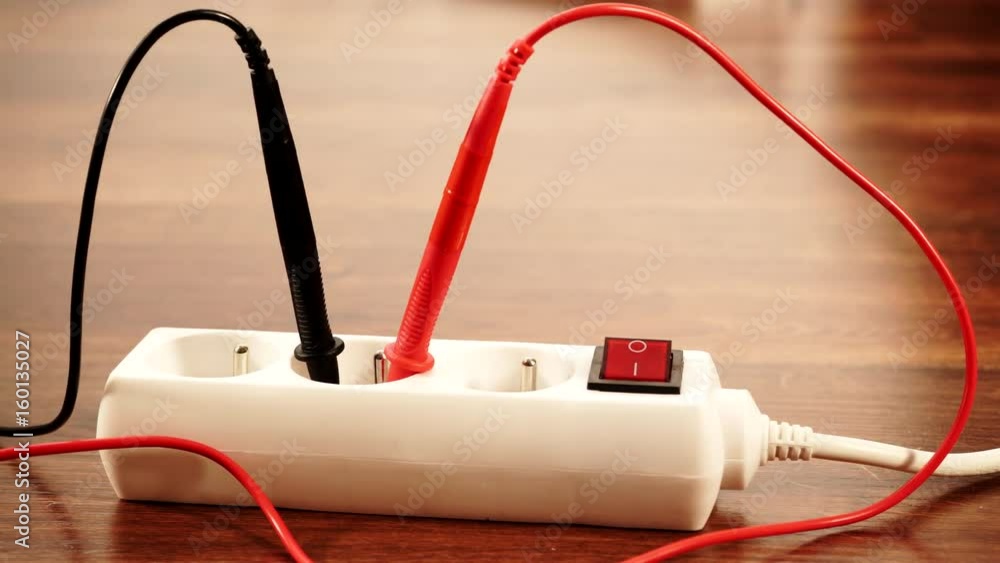 Vídeo do Stock: Measurement of voltage in electrical socket extension ...