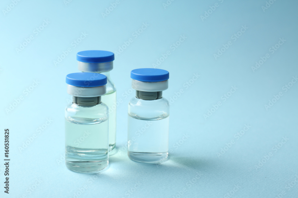 Medical ampules on colour background. Vaccination concept Stock Photo ...