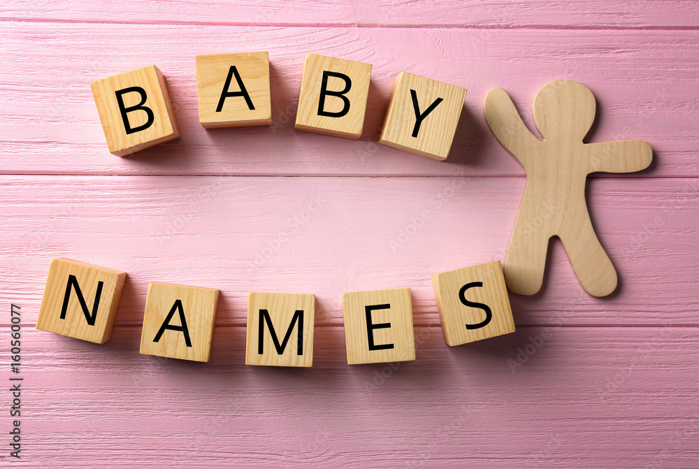 Wooden cubes with words BABY NAMES on color background. Concept of ...