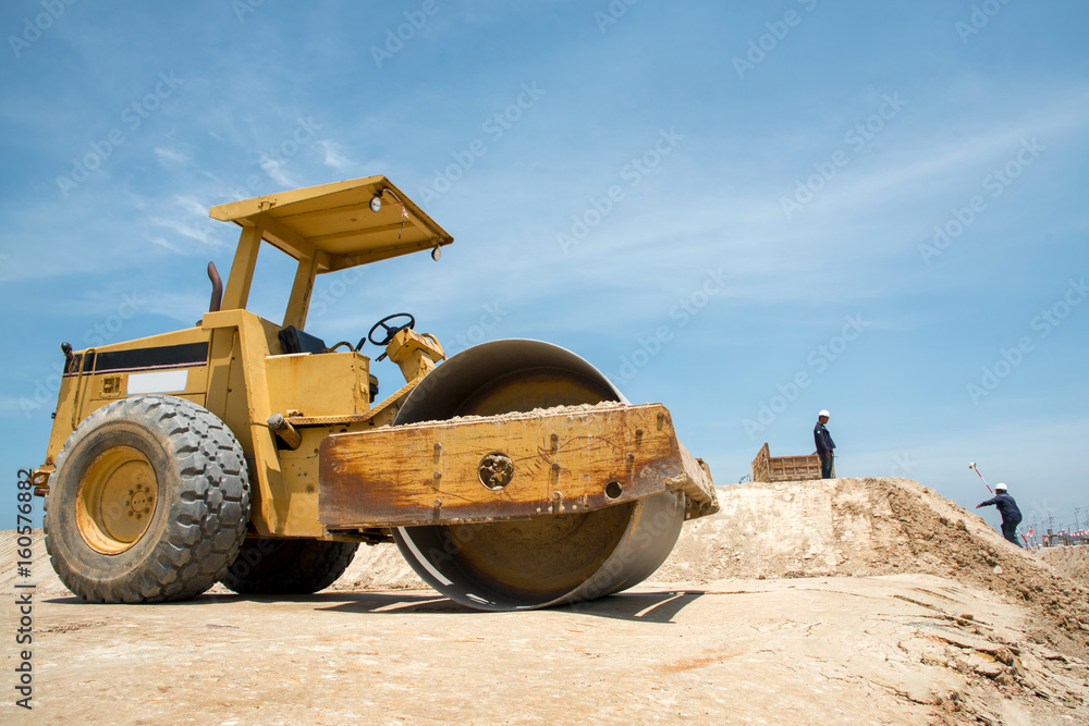 soil vibration roller during sand compacting works at construction site ...