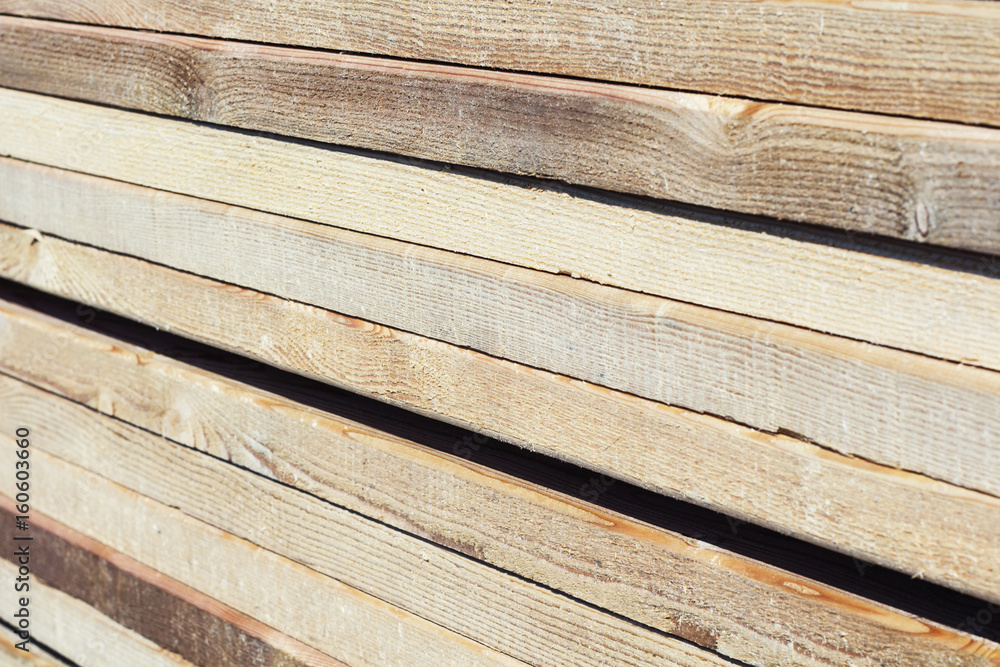 wooden planks on a construction site. Stock Photo | Adobe Stock
