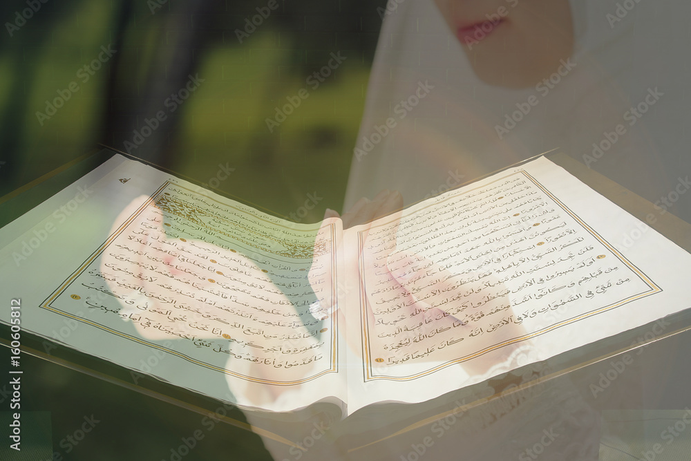 Holy Quran illuminated by the sun. Closeup of Islamic Book Holy Quran ...