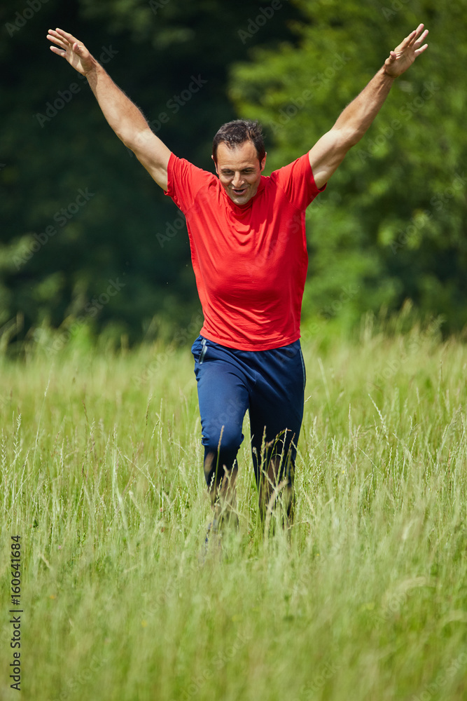 Happy man jumping for joy Stock Photo | Adobe Stock