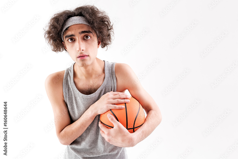 Scared thin male basketball player Stock Photo | Adobe Stock