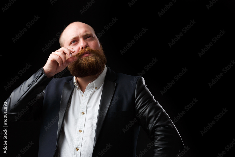 Man turns his ginger mustache Stock Photo | Adobe Stock