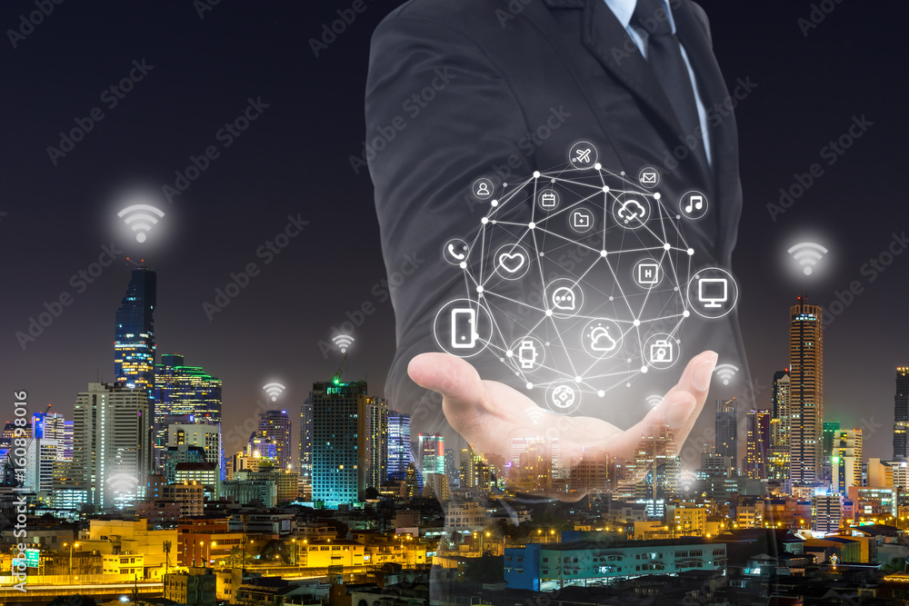Smart businessman holding digital network in Smart city, Everything ...