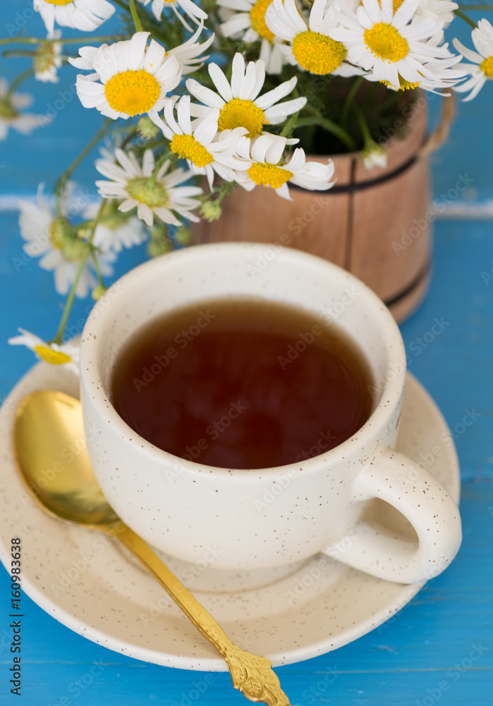 cup of herbal chamomile tea with camomile dry blossoms, dried camomile ...