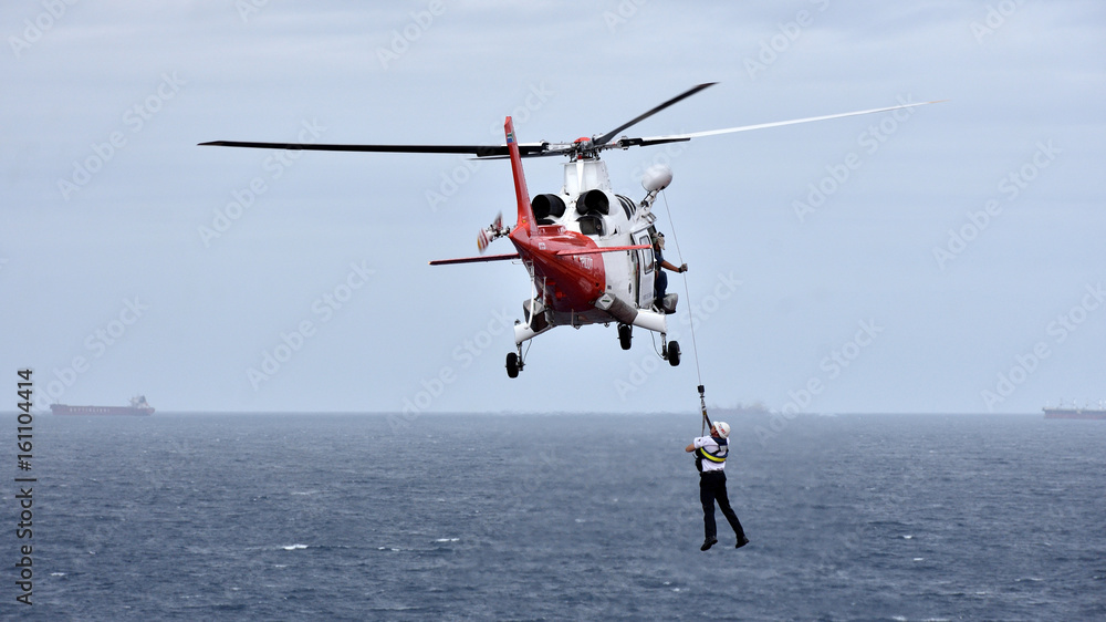 Pilot is disembarking from cargo ship by helicopter Stock Photo | Adobe ...