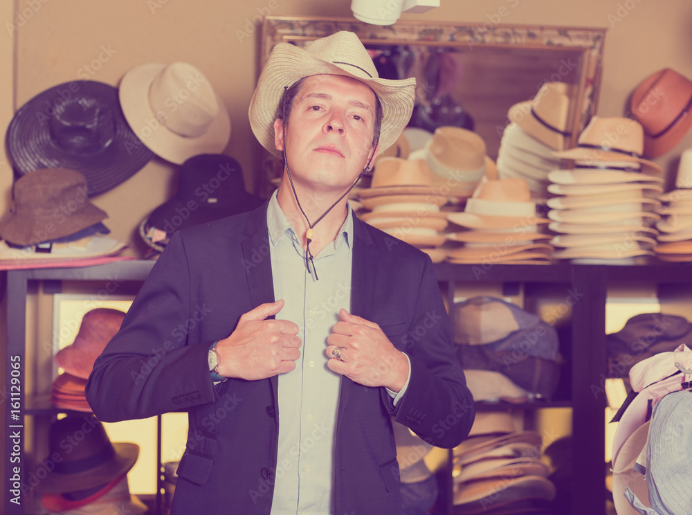 adult male try on western hat at the shopping center Stock Photo ...