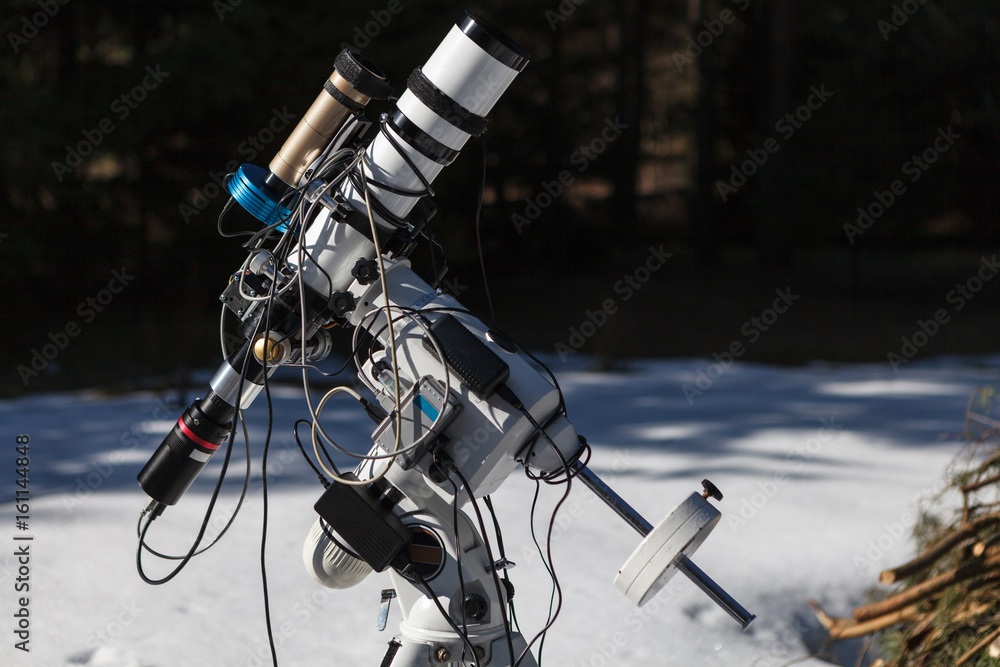 Professional astrophotography telescope equipped with guider scope and ...