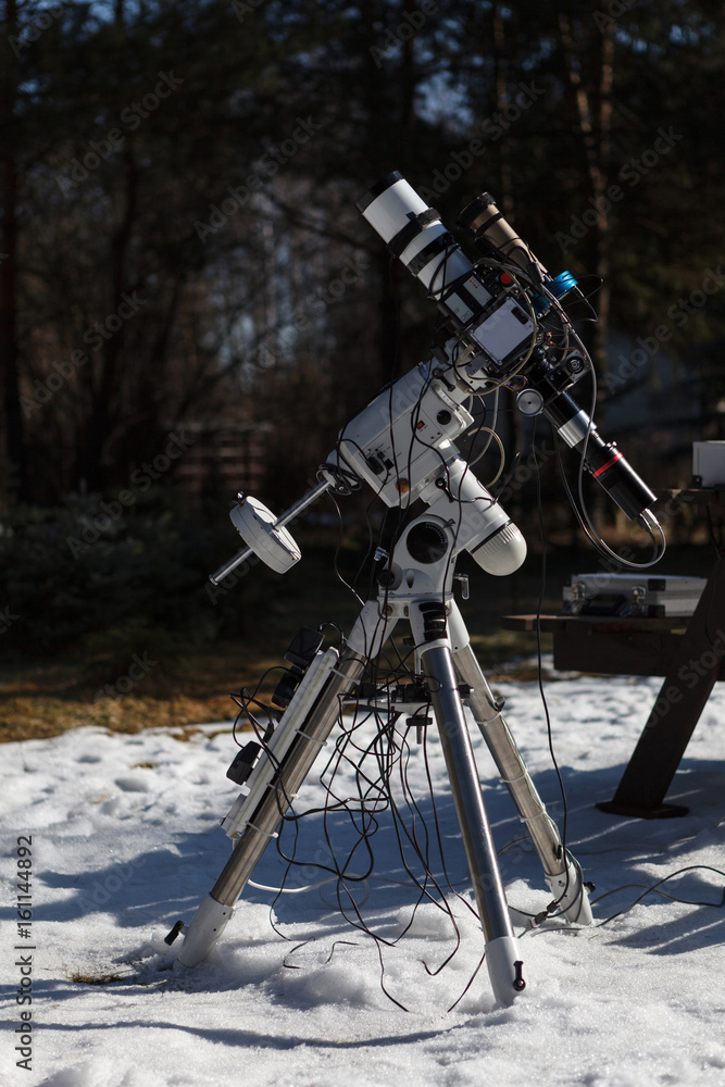 Professional astrophotography telescope equipped with guider scope and ...