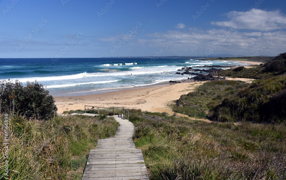 Sea beach wooden walkway, path entrance. Sandy ocean beach entrance at ...