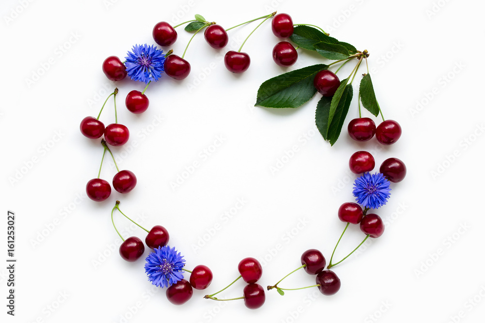 A ripe cherry lined in the shape of a frame with green leaves ...