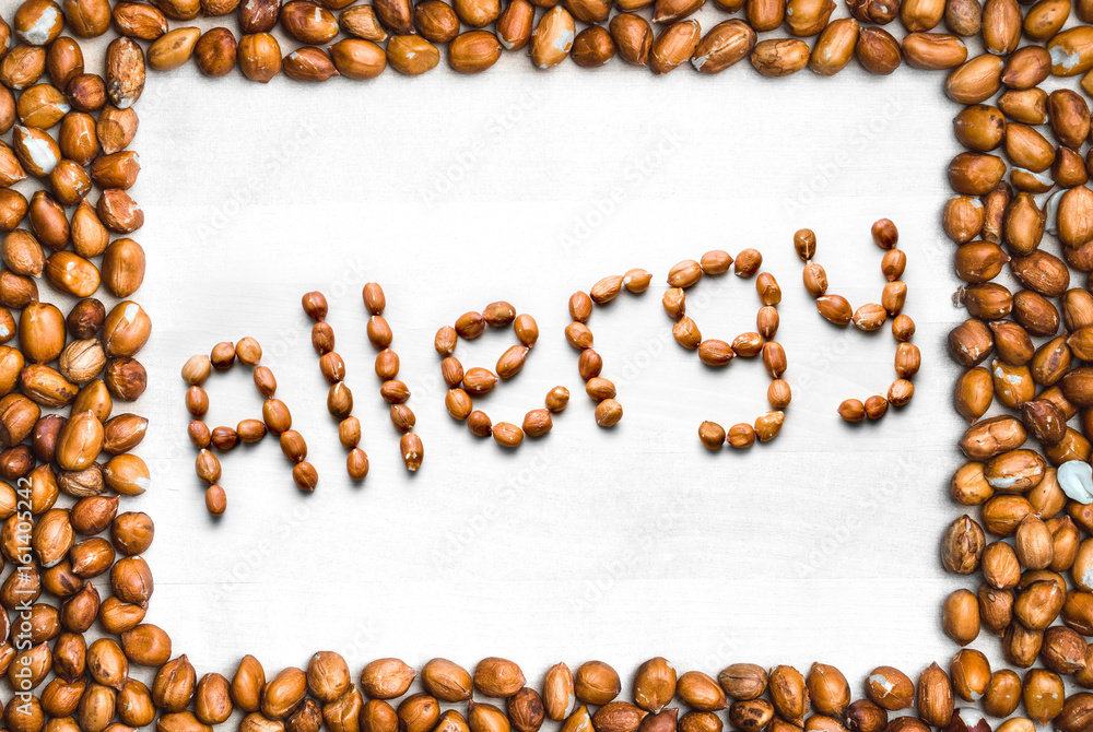 Allergy written with peanuts and surrounded with nut frame. Word and ...