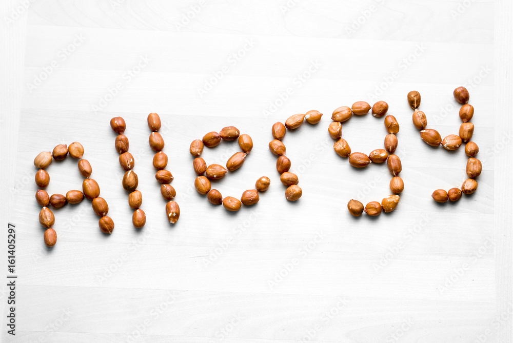 Allergy written with peanuts. Word and text made from nuts. Groundnuts ...