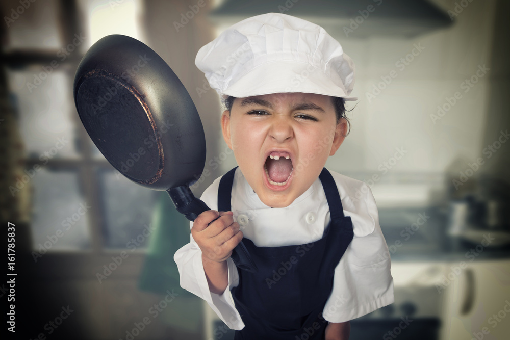 Angry girl chef Stock Photo | Adobe Stock