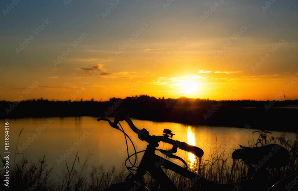 Bike on sunset background. Stock Photo | Adobe Stock
