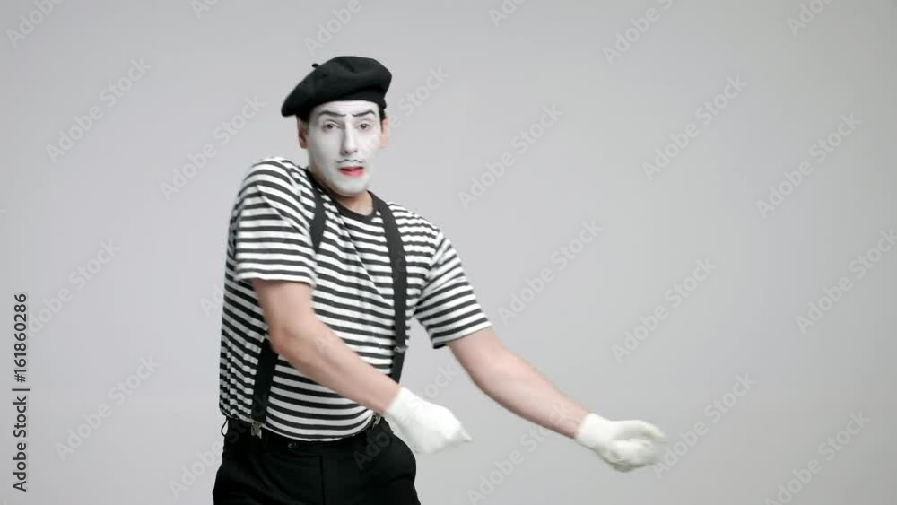 Mime artist pulling an invisible rope Stock Video | Adobe Stock