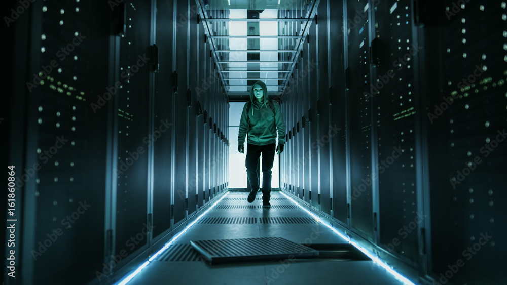 Hooded Hacker in a Mask Walks Through Working Data Center with Open ...