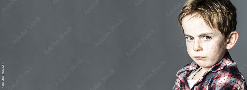 mad little boy with an attitude standing from profile, panorama Stock ...