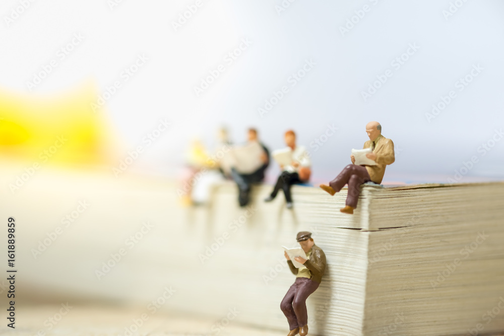 Reading and hobby concept. Group of miniature mini figures businessman ...