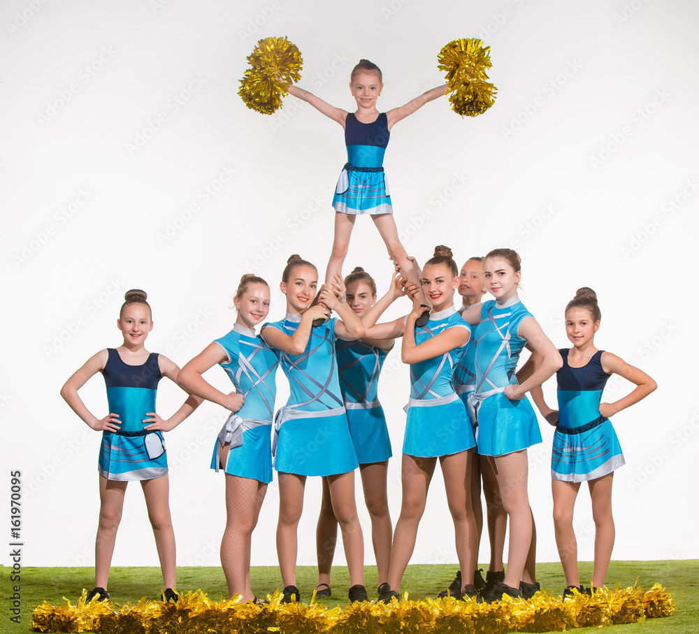 The group of teen cheerleaders posing at white studio Stock Photo ...
