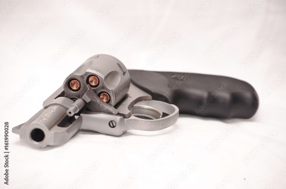 Loaded stainless revolver with an open cylinder Stock Photo | Adobe Stock