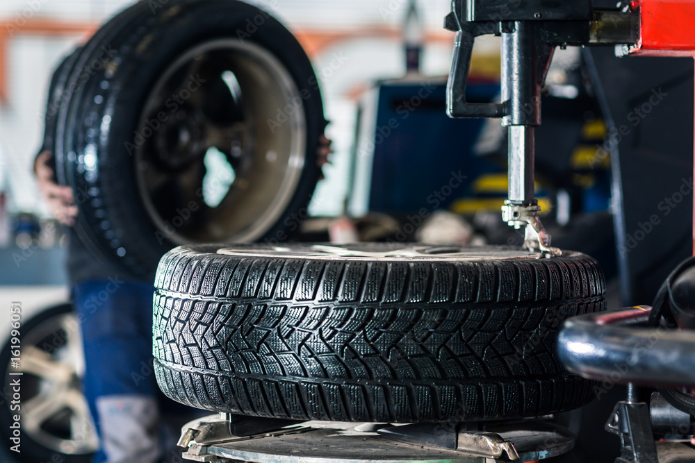 Inside a garage - modern car waiting for the mechanic to change its ...