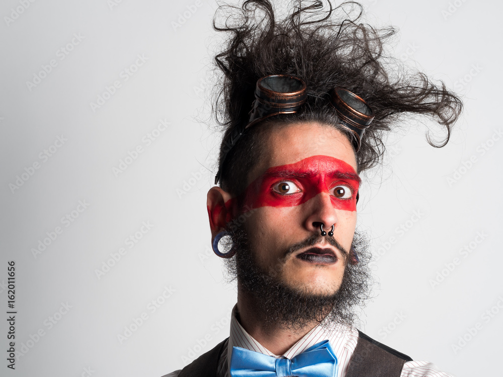 Portrait of a handsome theatrical actor with a mime make-up on his face ...