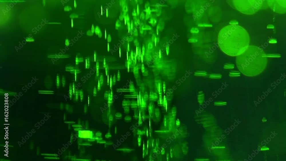 Liquid is bright green in a glass chemical flask: texture and processes ...