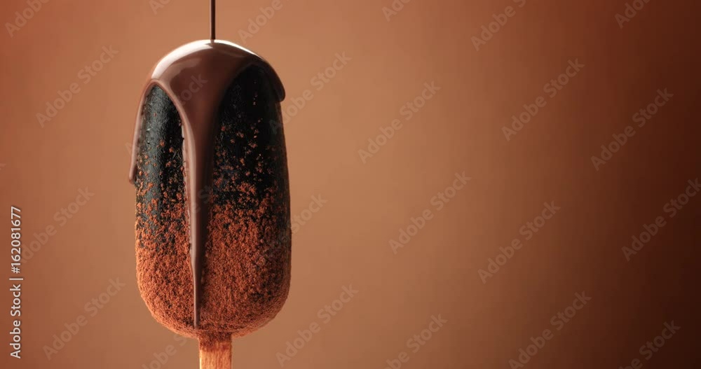 chocolate ice cream on a stick and liquid chocolate covered it ...
