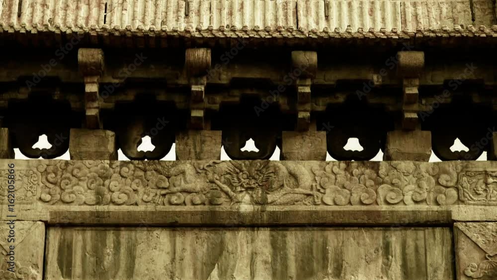China stone arch & Carved stone dragon in front of ancient city gate ...