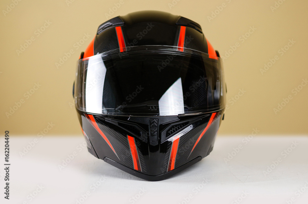 Beautiful black with red motorcycle helmet. With a transparent visor ...