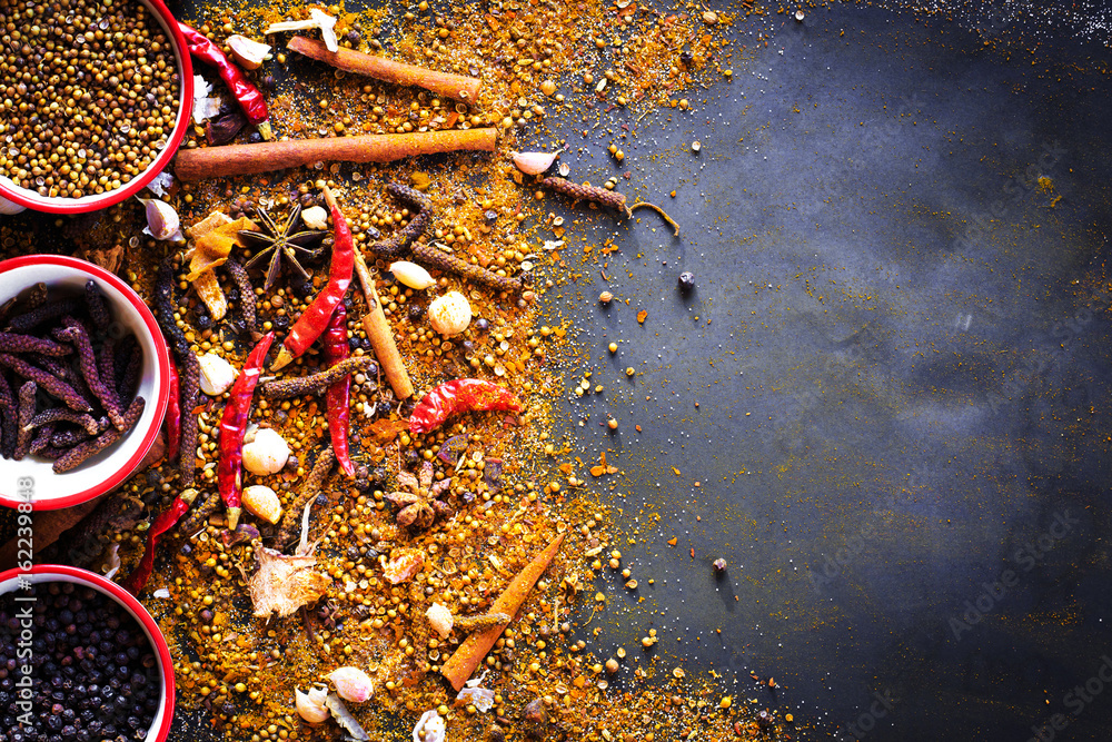 Variety Spices and herbs on black stone background, Top view with empty ...