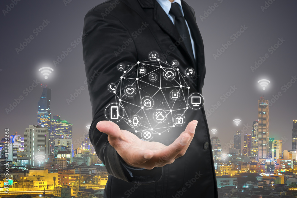 Smart businessman holding digital network in Smart city, Everything ...
