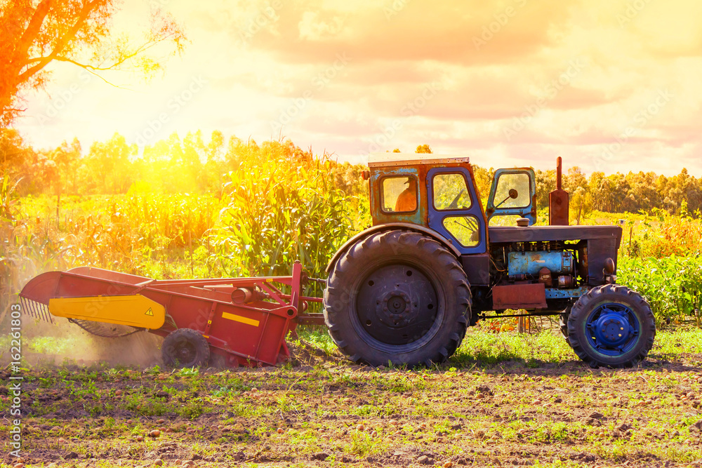 Poster small tractor working in the field. smallholder agriculture ...