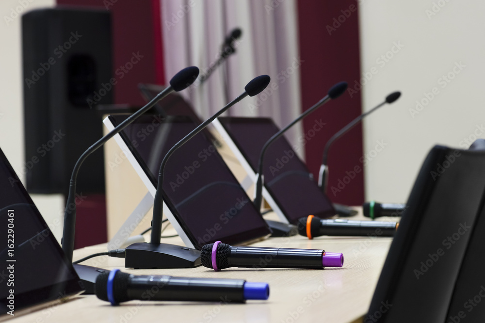 Conference room ready for business meeting, table with microphones ...